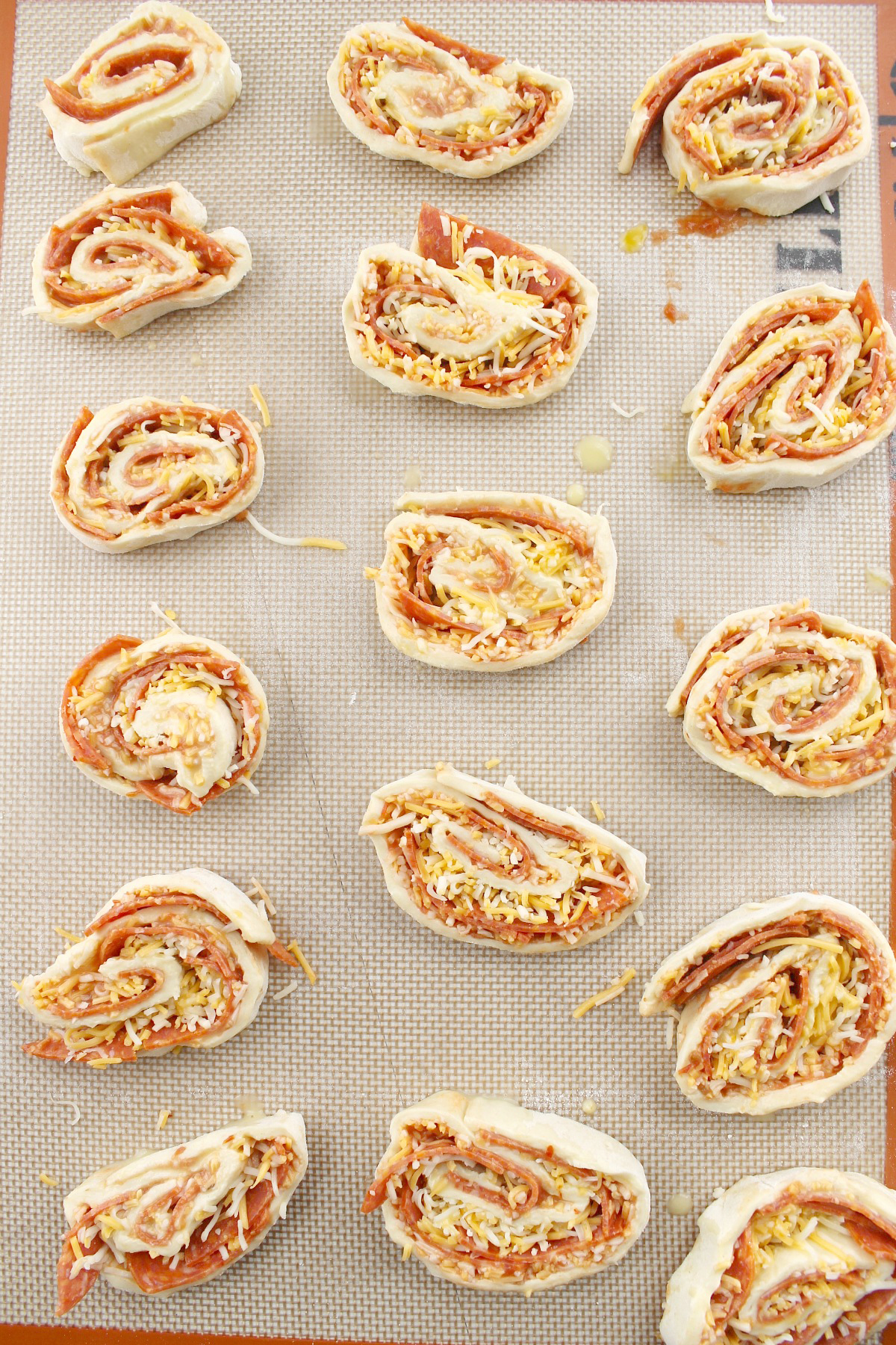 Pepperoni Pizza Pinwheels Recipe - Food Fanatic